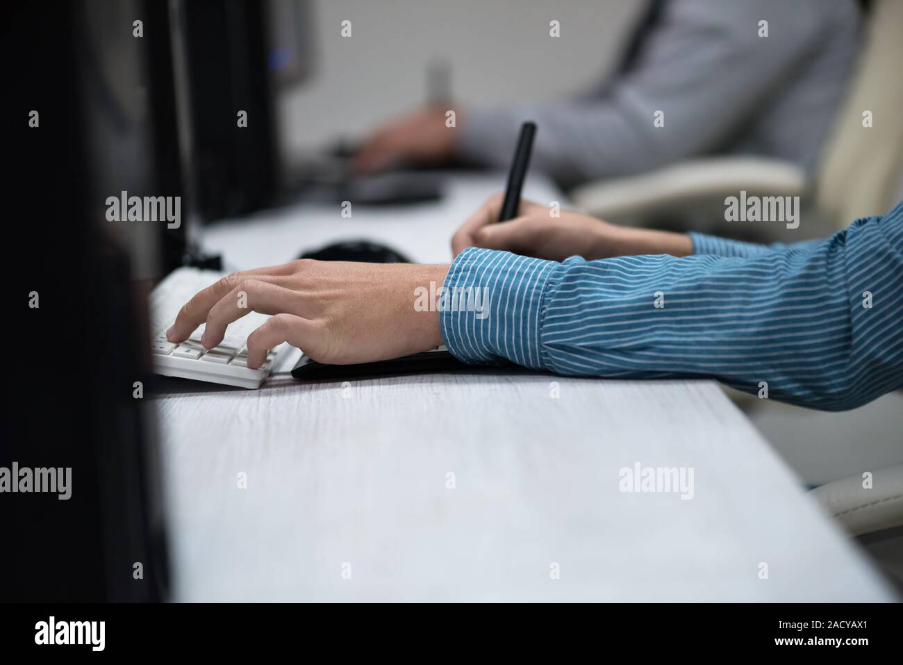 photo editor at his desk Stock Photo - Alamy