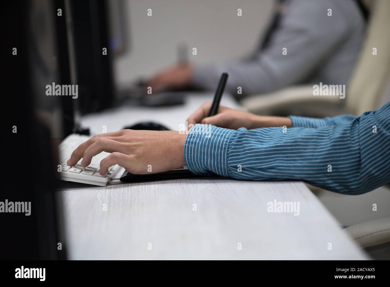 photo editor at his desk Stock Photo - Alamy
