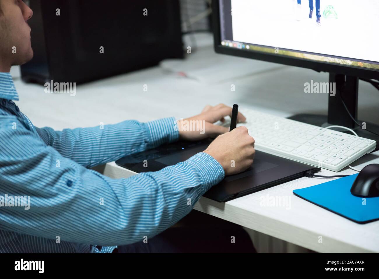 photo editor at his desk Stock Photo - Alamy