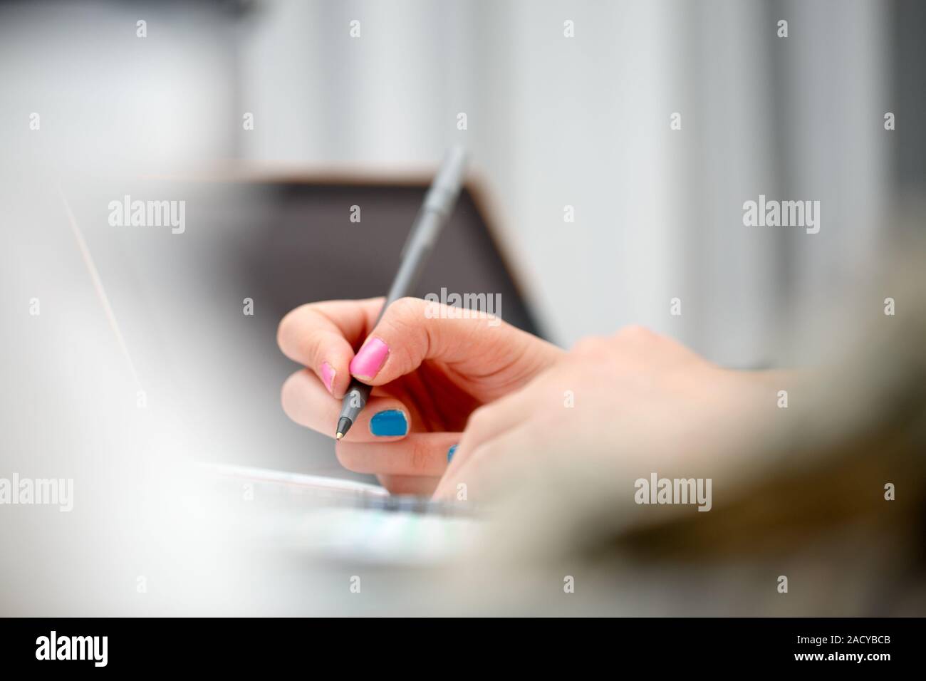 Female writing pen hi-res stock photography and images - Alamy