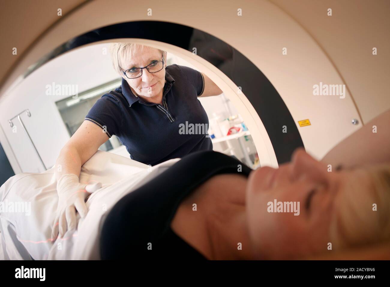 A patient positioned for a CT scan. Also known as CAT (computed axial ...