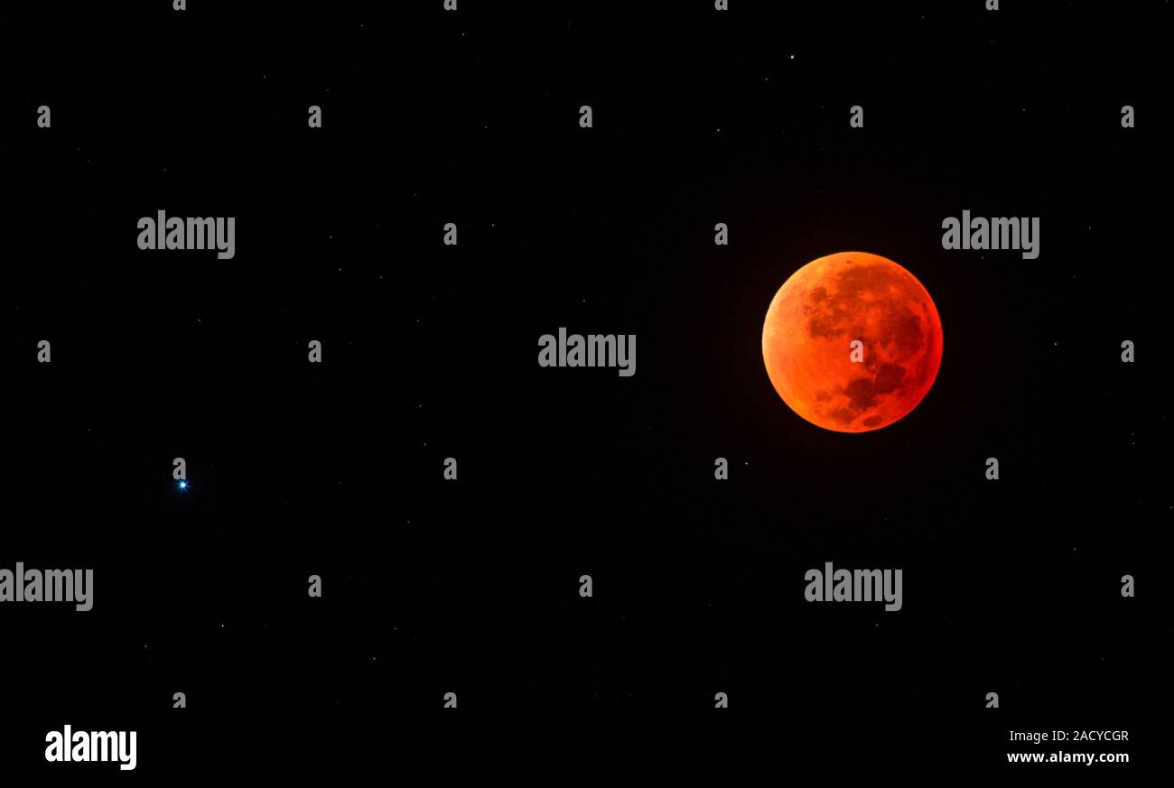 Total lunar eclipse, and bright blue-white star Spica in the ...