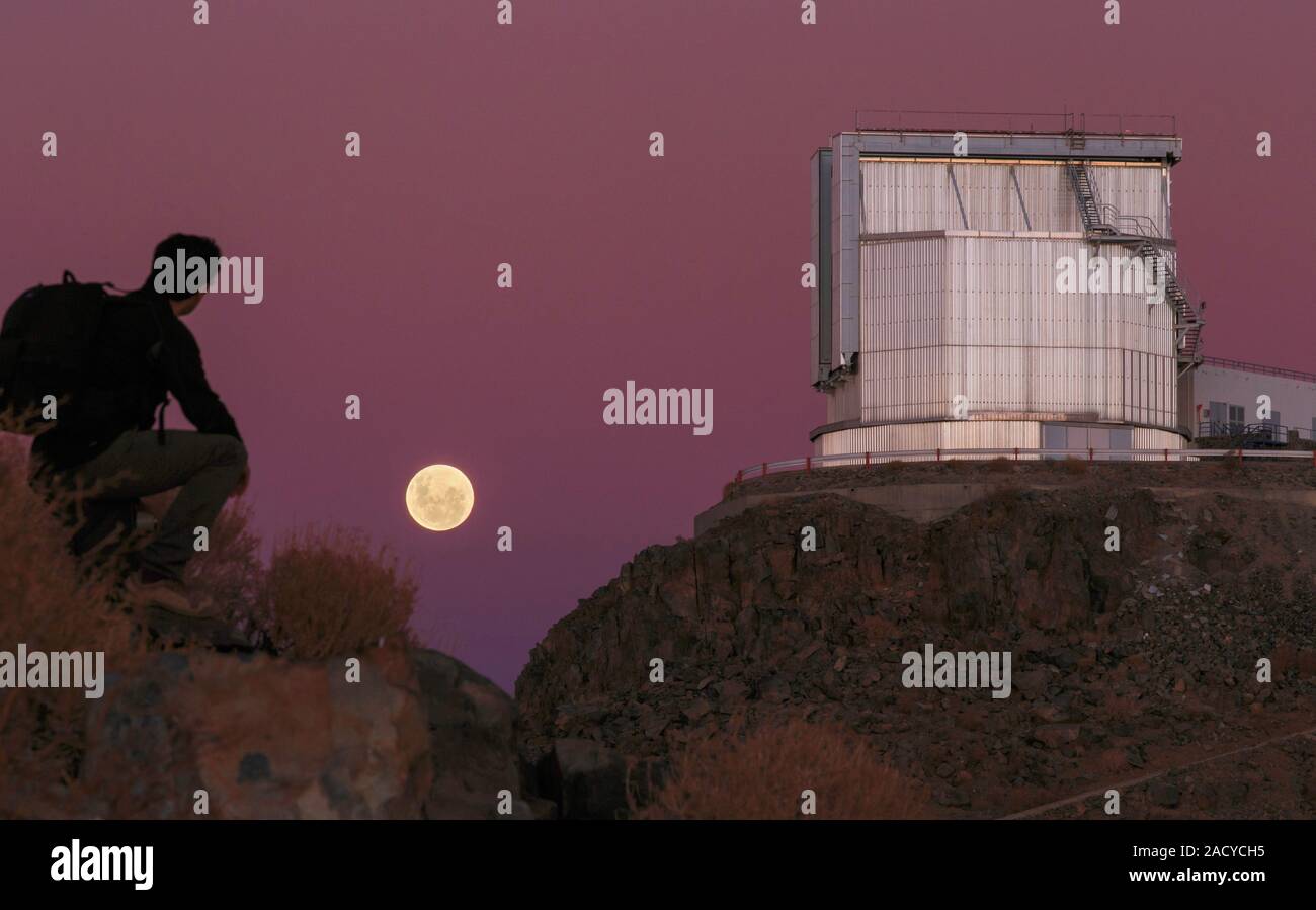A hiker watches the full moon rise behind the 3.58-metre New Technology ...