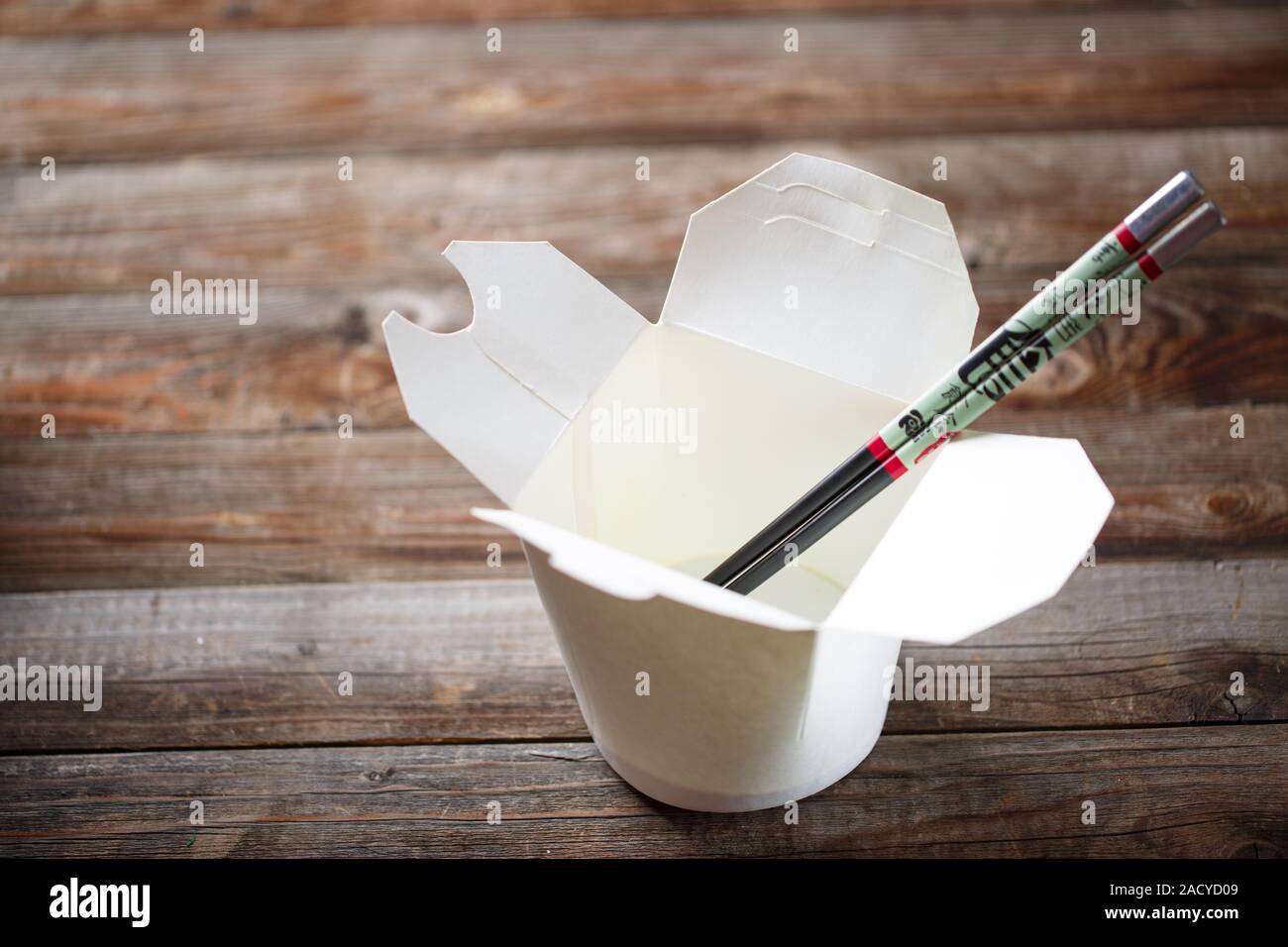 Blank Chinese food container on old wood table Stock Photo - Alamy