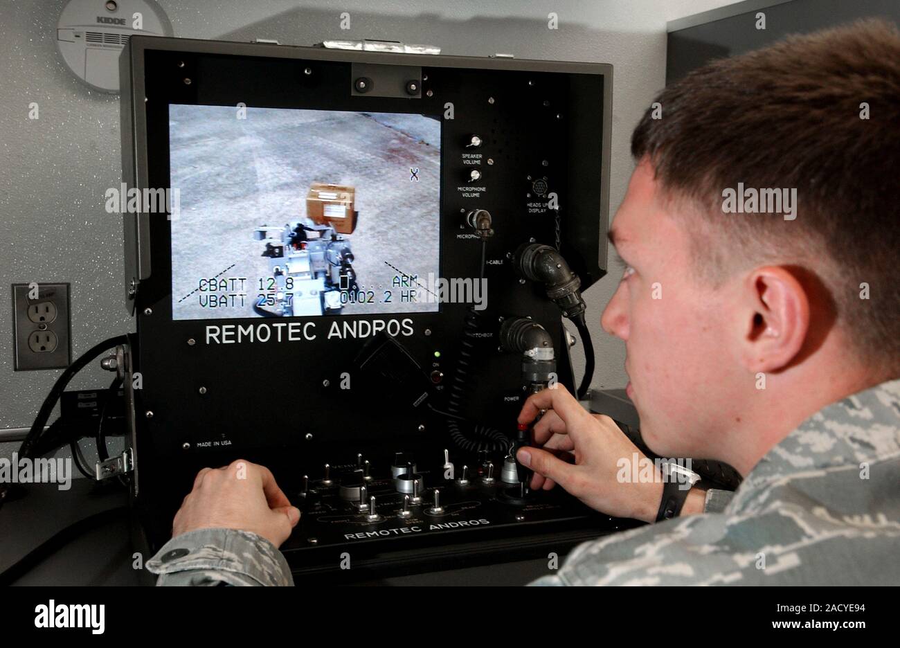 Remote controlled bomb disposal. A member of a military explosive ...