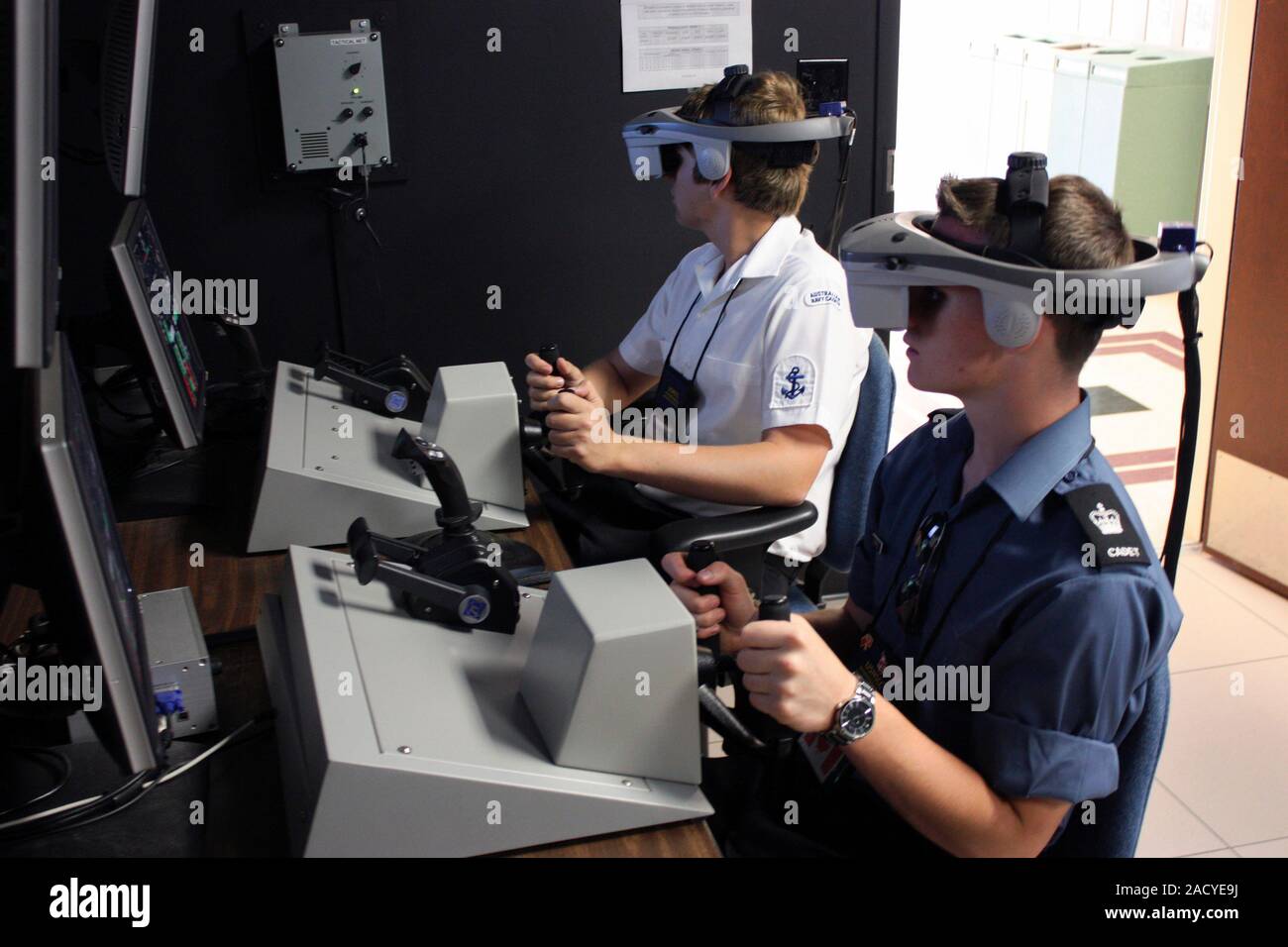 Boat simulator. Sea cadets operate a console of the rigid-hull ...