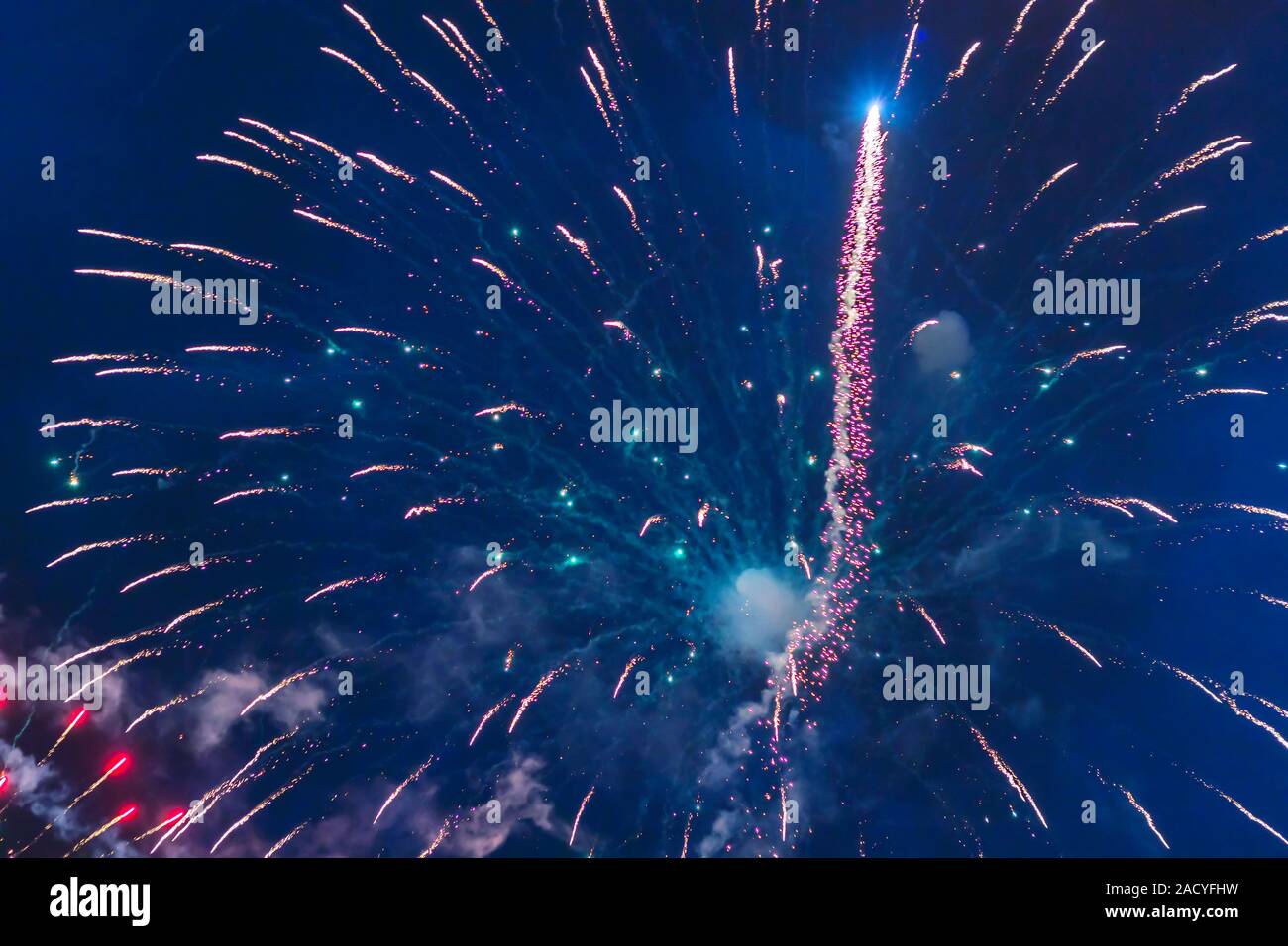 Inexpensive fireworks, over the city, red and blue. Motion blur. Light ...