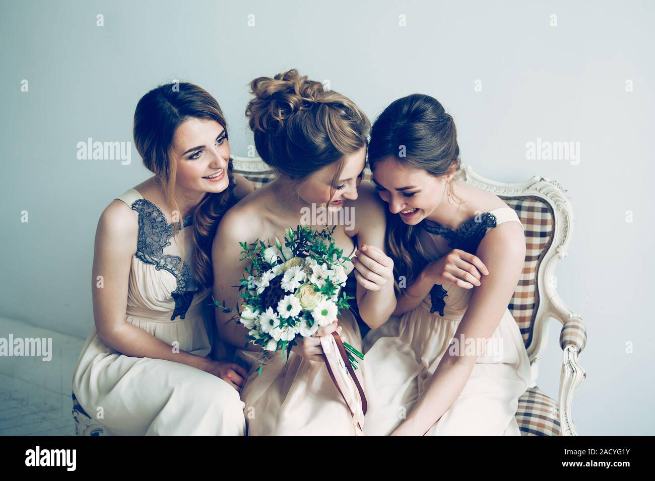 Young bridesmaid sitting hi-res stock photography and images - Alamy
