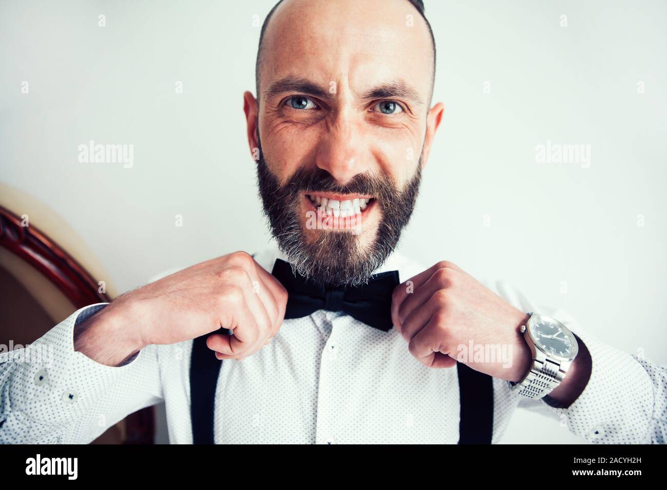 Straightening bow tie hi-res stock photography and images - Alamy