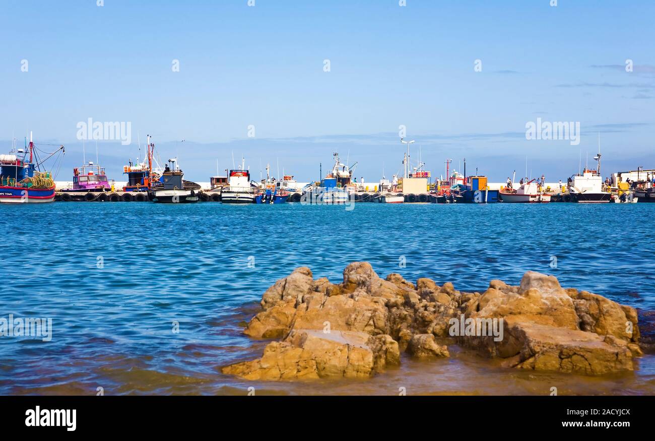 Kalk Bay Harbour with colourful fishing boats from beach, Cape Town ...