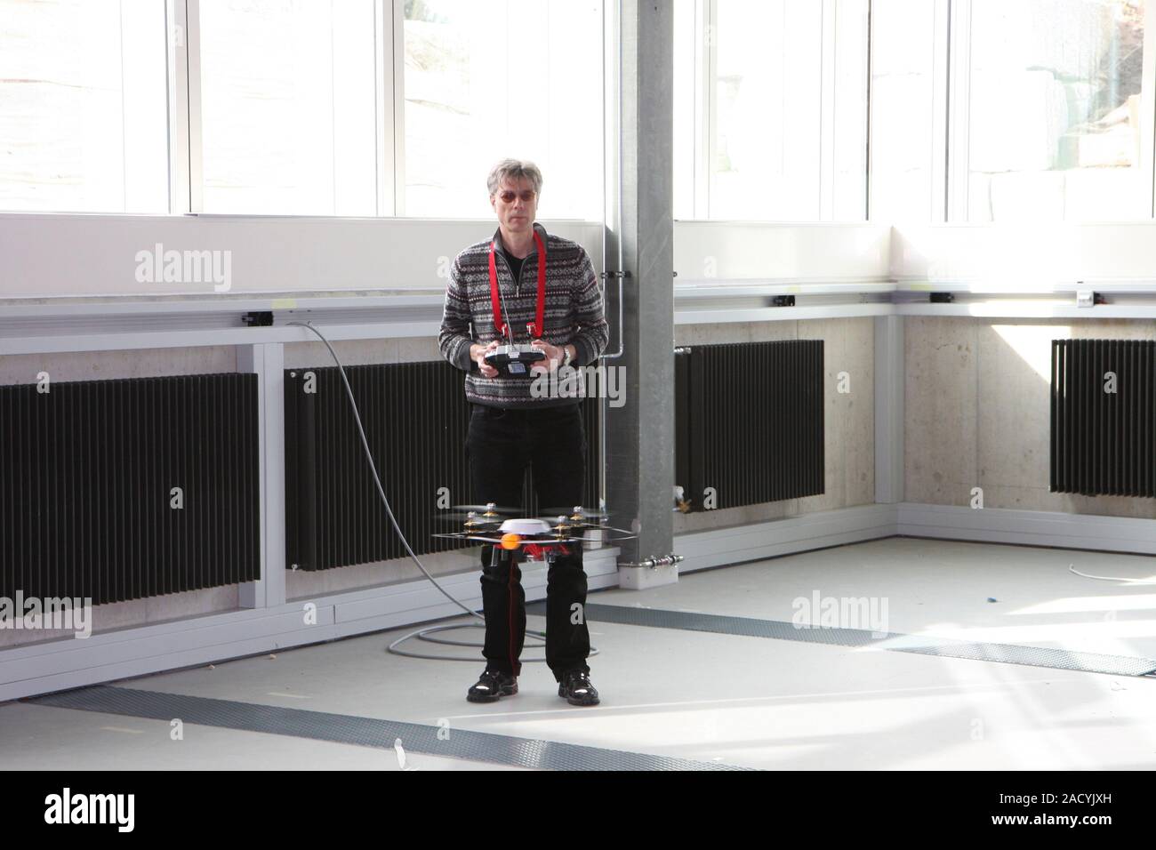 Flying a quadcopter drone. IBM scientist Ronald Luijten operating the ...