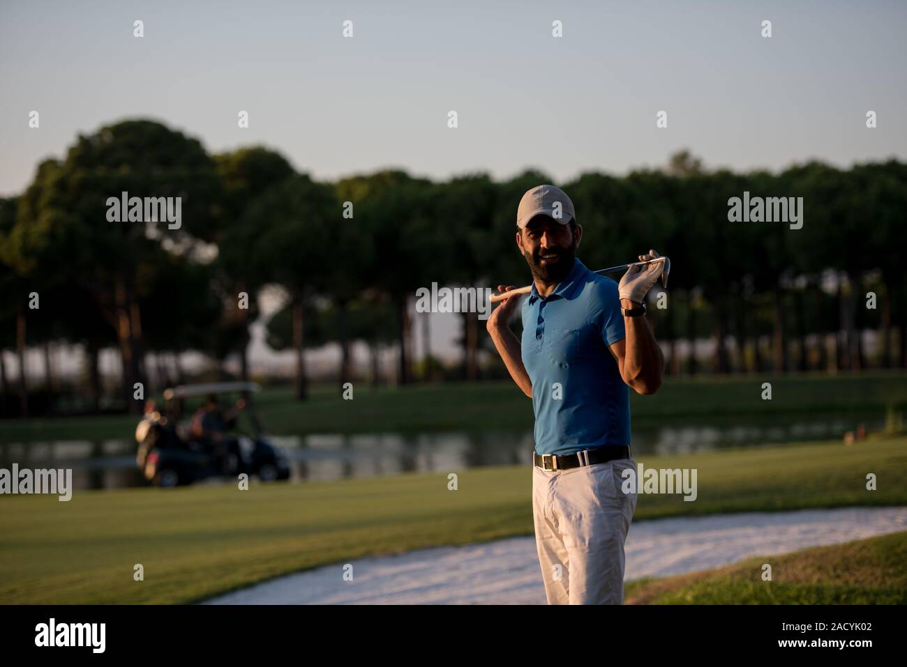 golfer portrait at golf course on sunset Stock Photo - Alamy