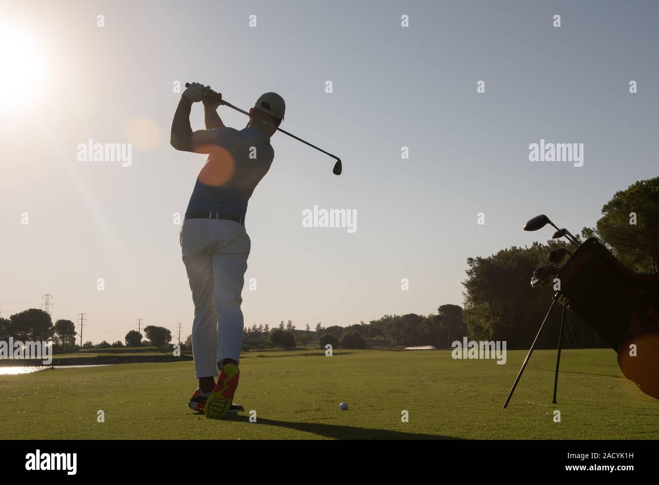golf player hitting shot Stock Photo - Alamy