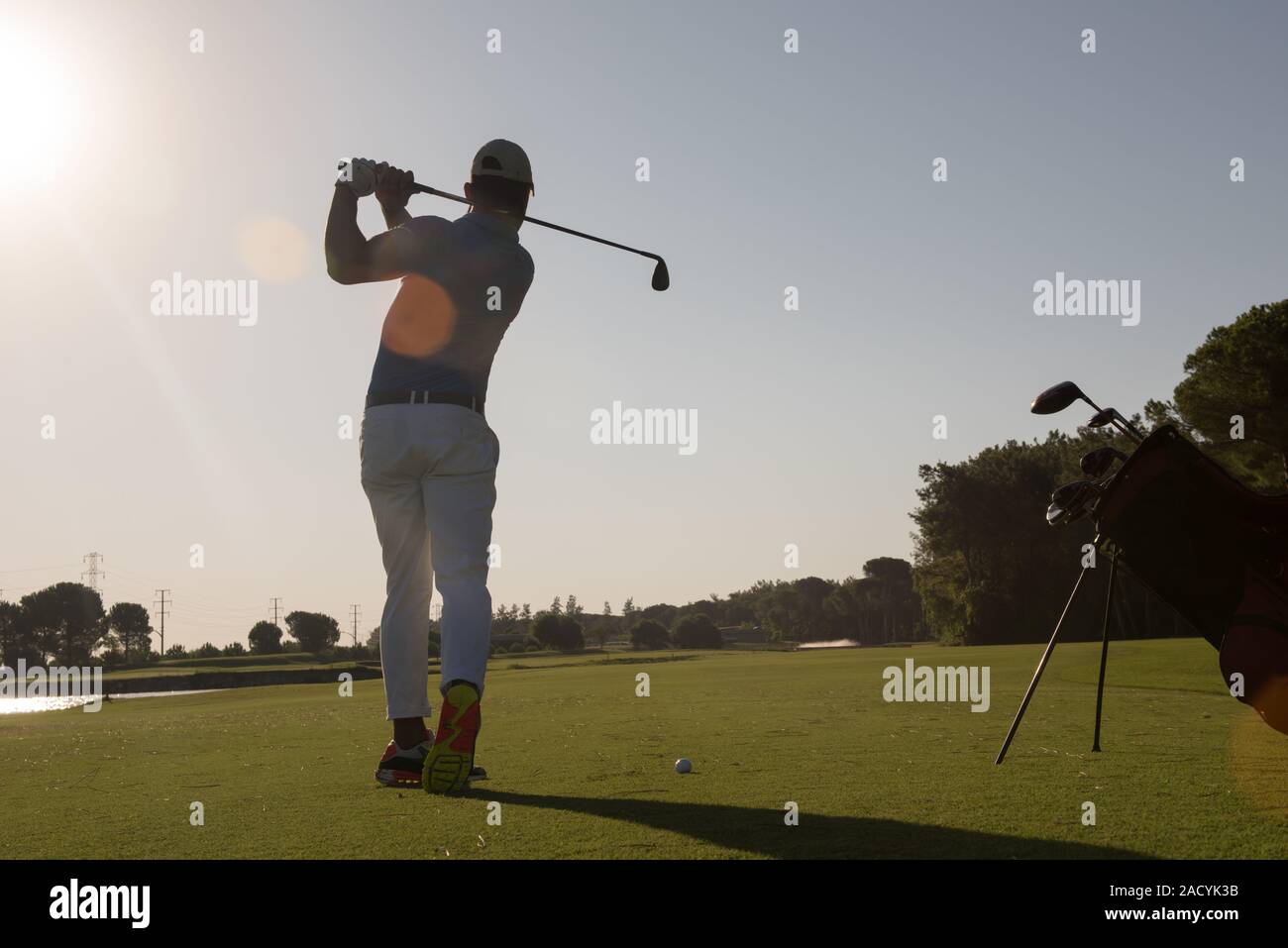 golf player hitting shot Stock Photo - Alamy