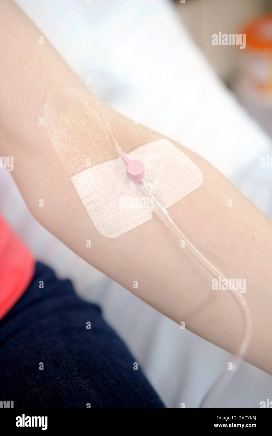 Taking blood. Close-up of a cannula being used to take a blood sample ...