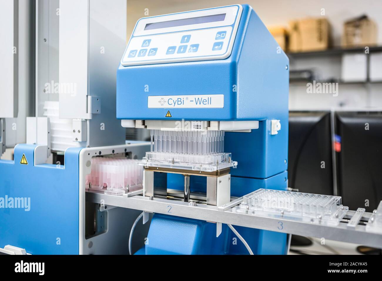 High-throughput screening machine. Close-up of the multi-well sampler ... High-throughput screening machine. Close-up of the multi-well sampler ...
