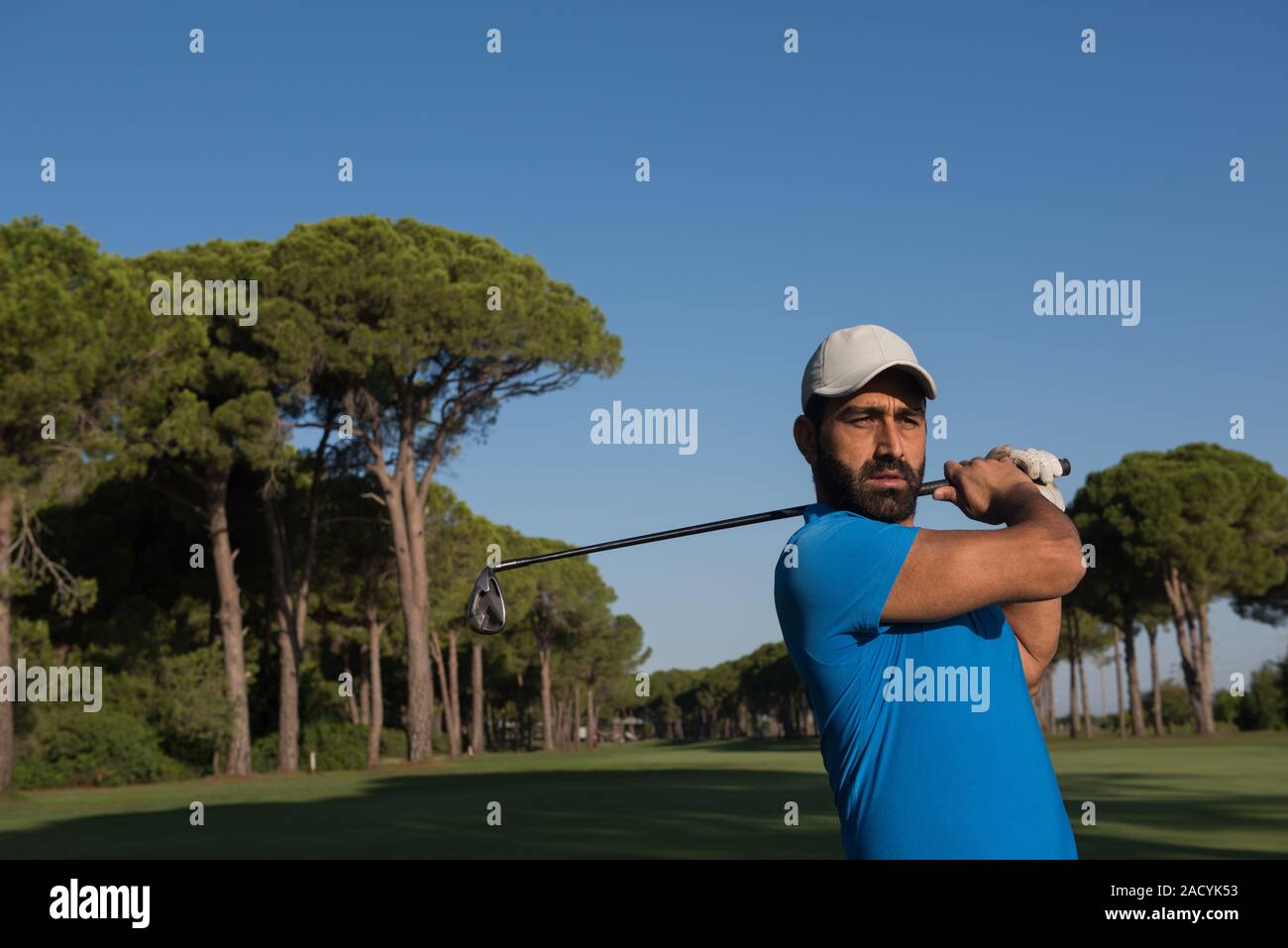 golf player hitting shot Stock Photo - Alamy