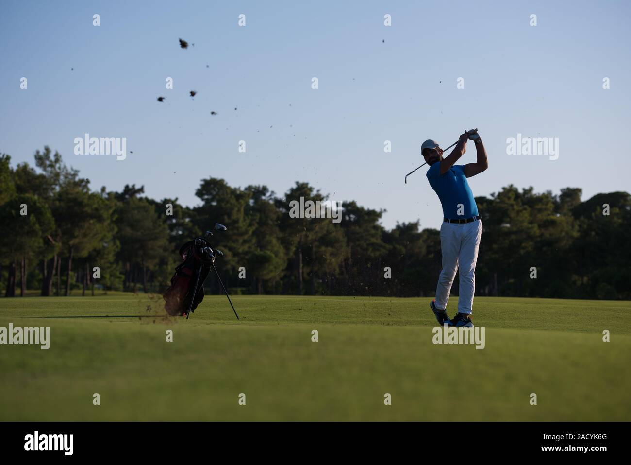 golfer hitting long shot Stock Photo - Alamy