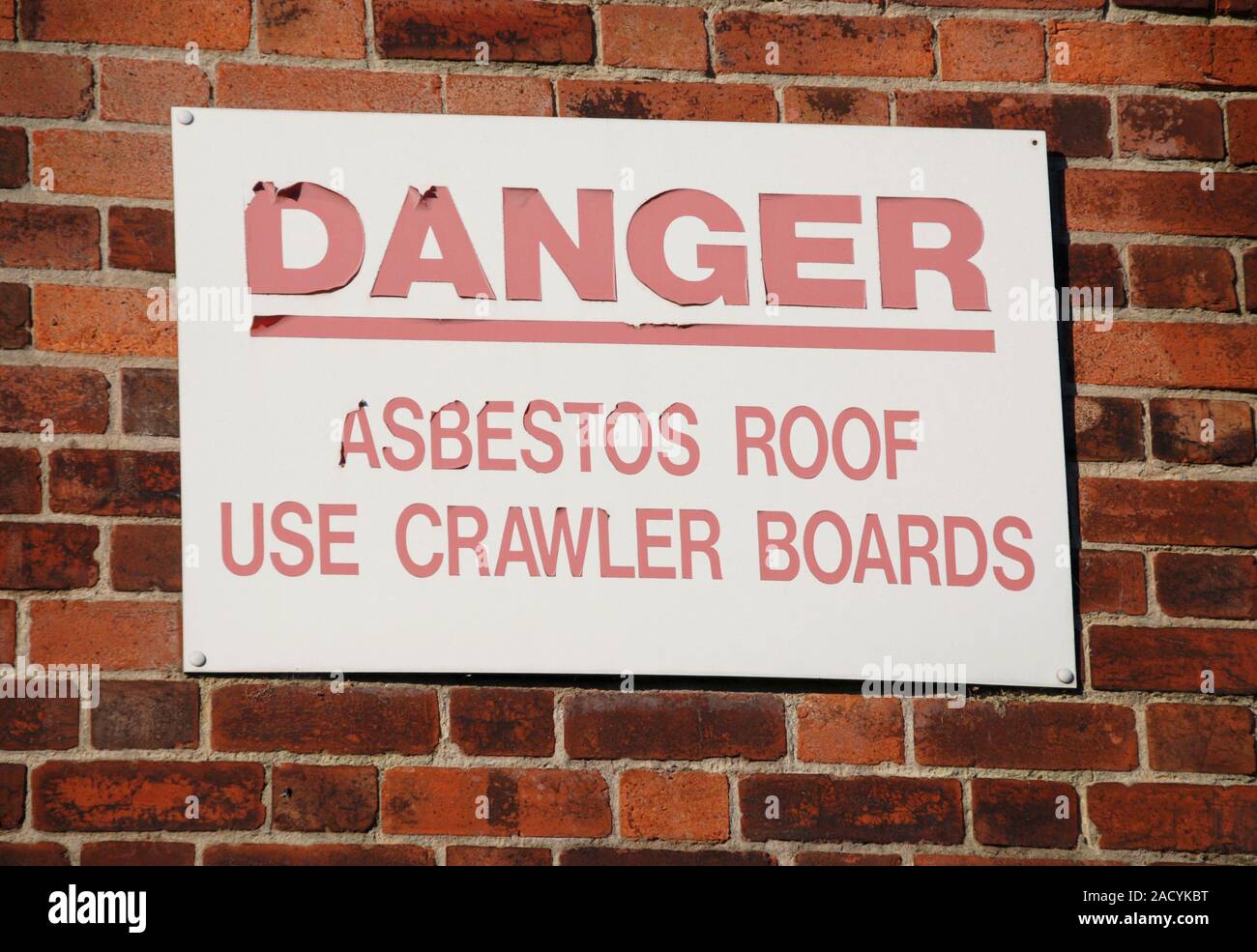 Asbestos warning sign on a building Stock Photo - Alamy