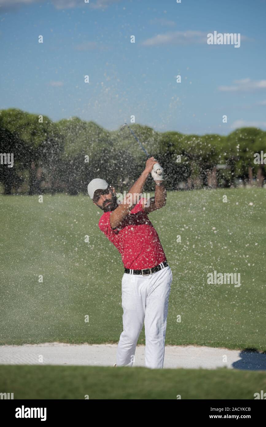 golfer hitting a sand bunker shot Stock Photo - Alamy