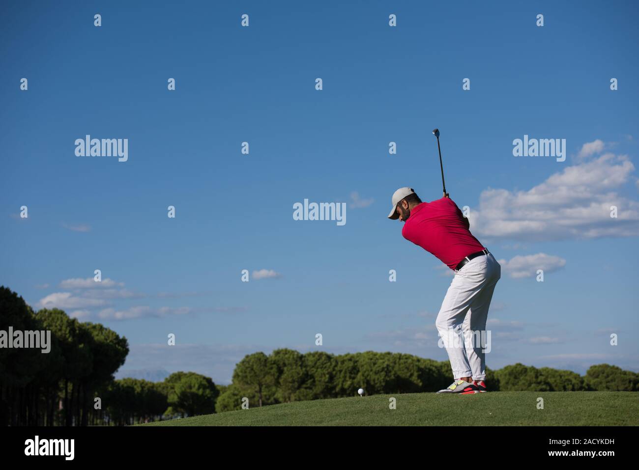 golf player hitting long shot Stock Photo - Alamy