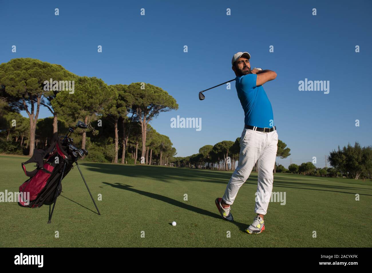 golf player hitting shot Stock Photo - Alamy