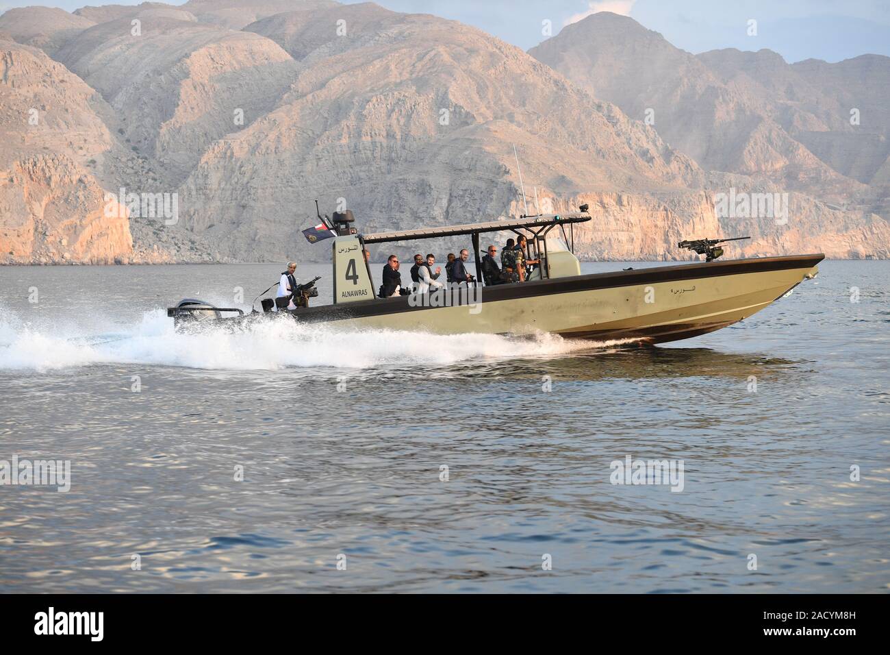The Duke of Cambridge (seated front) on the water in a Royal Navy of ...