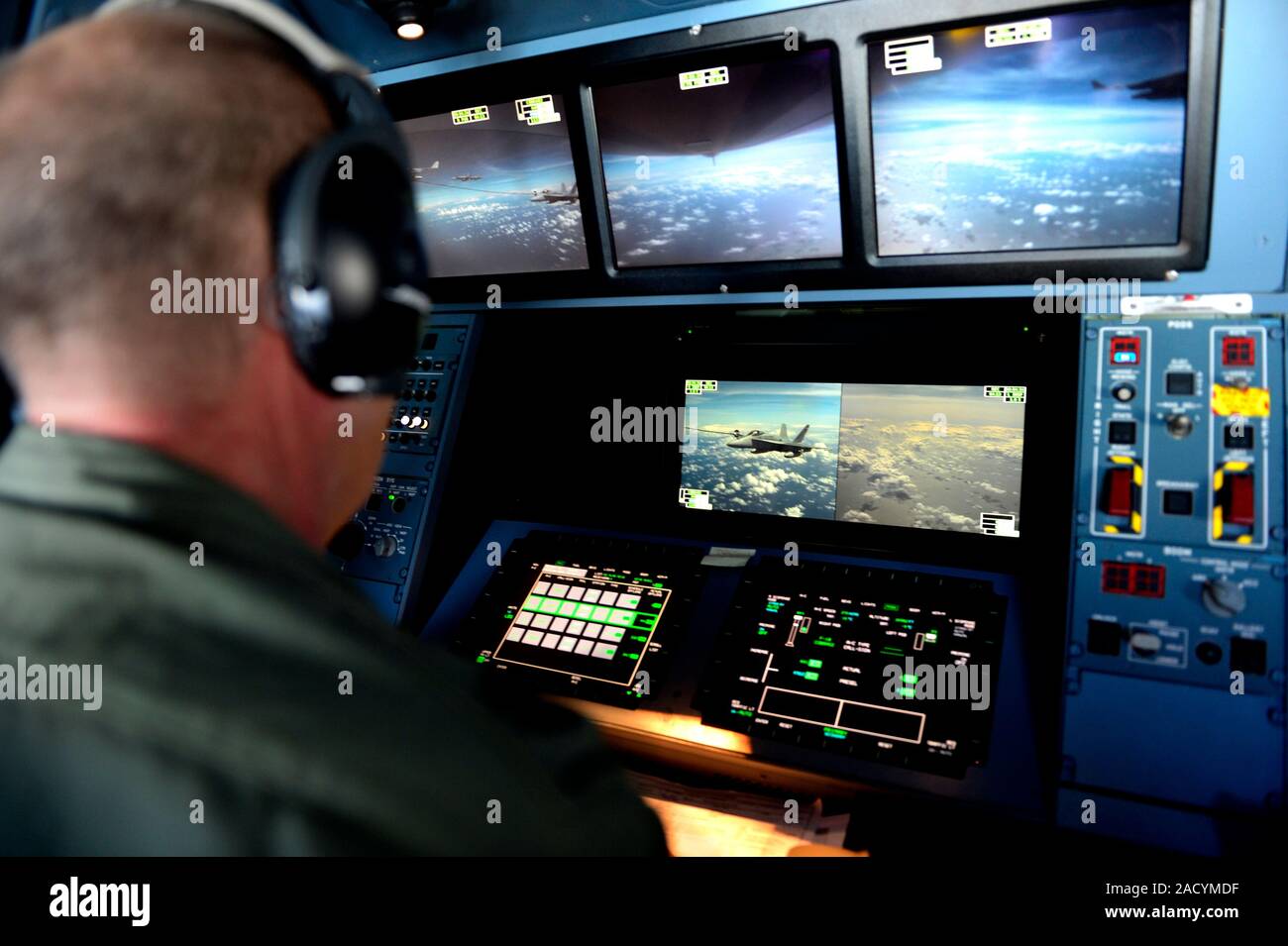 Air Force mid-air refuelling. Air Refuelling Operator controlling the ...