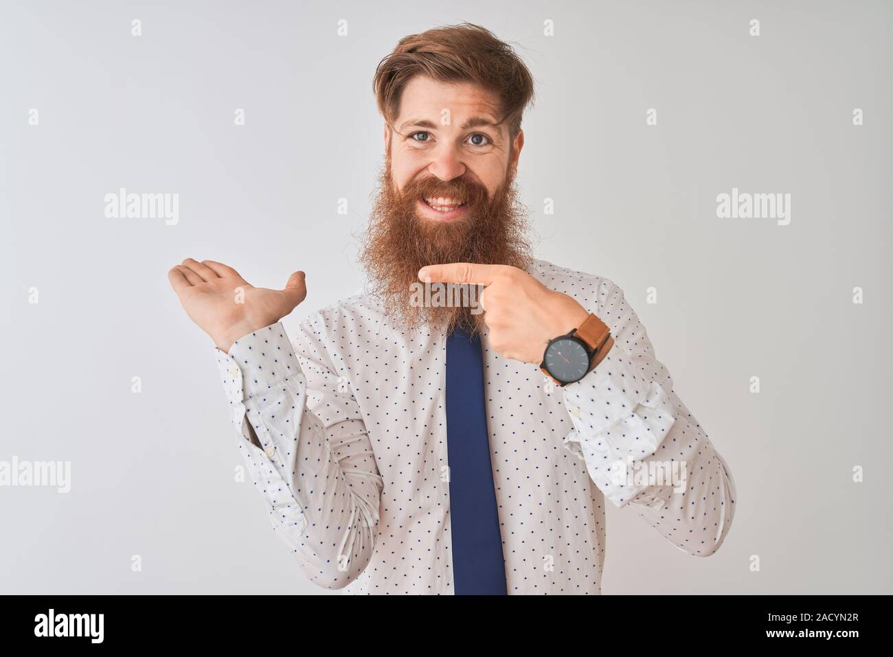 Young redhead irish businessman standing over isolated white background ...