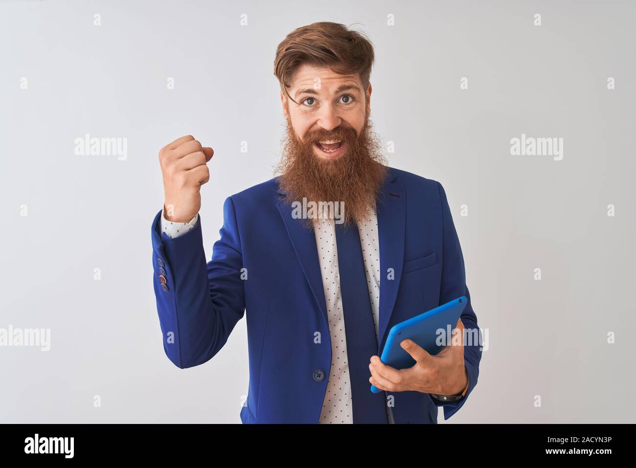 Portrait redhead man celebrating using hi-res stock photography and ...