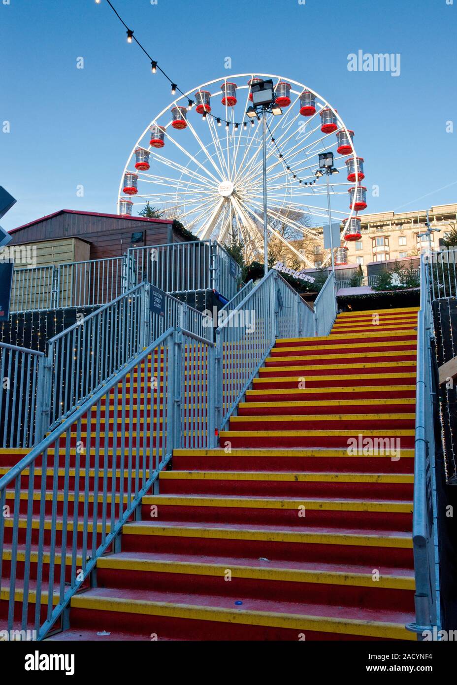 Christmas market steps leading up to Big Wheel fairground ride ...