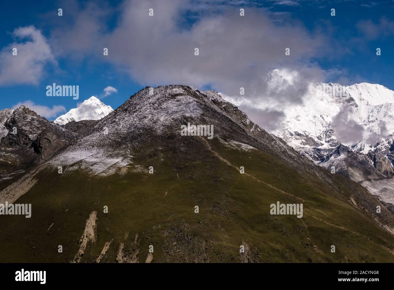 The summit of Gokyo Ri, summit of Mt. Cho Oyu covered by monsoon clouds ...