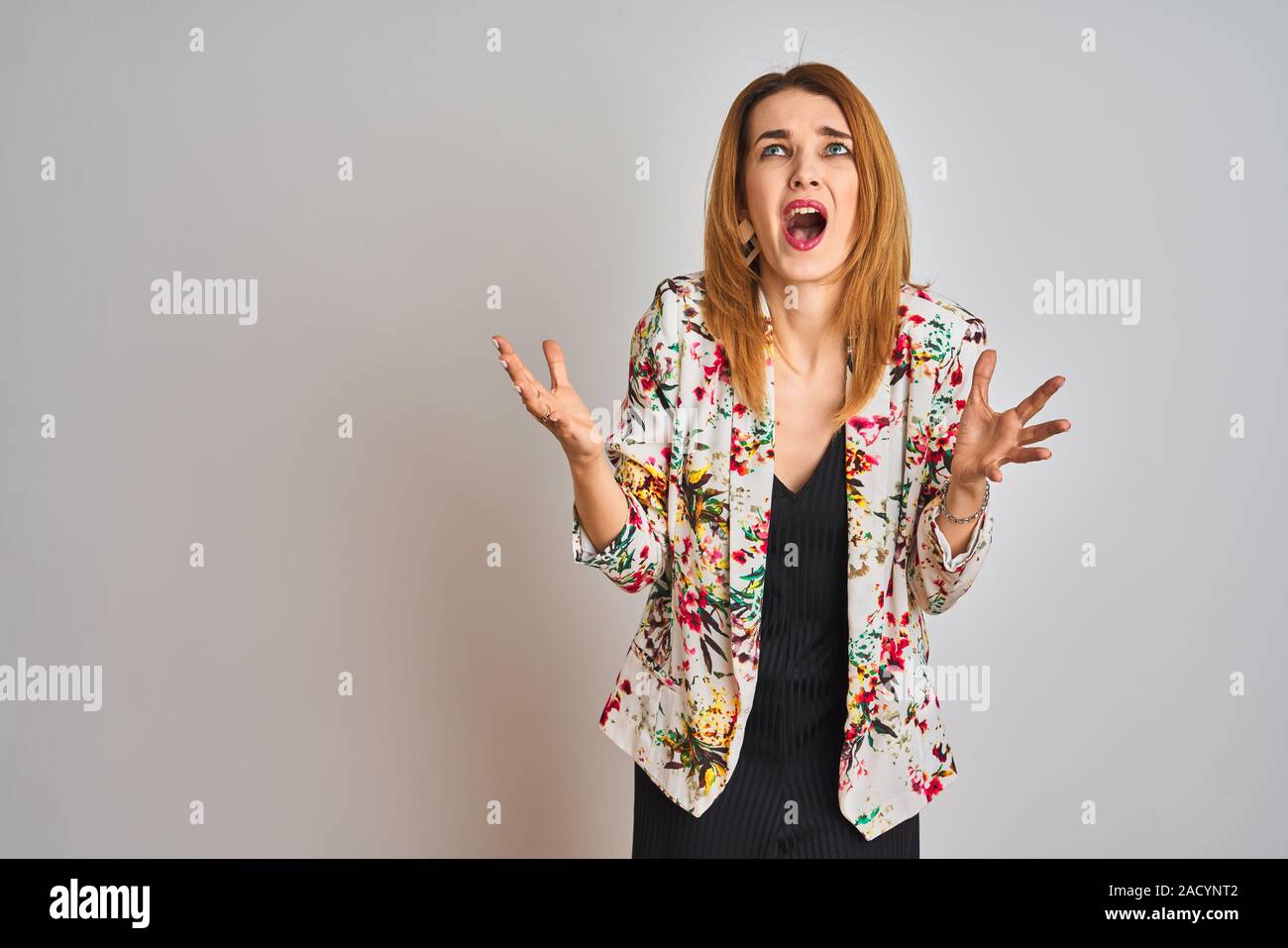 Young caucasian business woman wearing spring floral jacket suit over ...