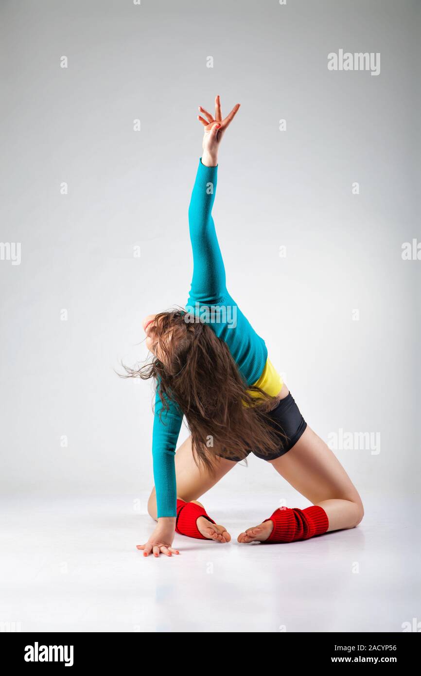 Modern style dancer posing on grey background Stock Photo - Alamy