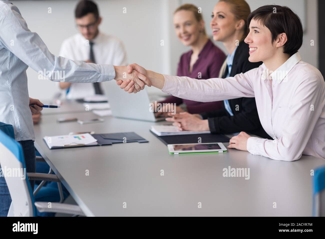 Business womans handshake Stock Photo - Alamy