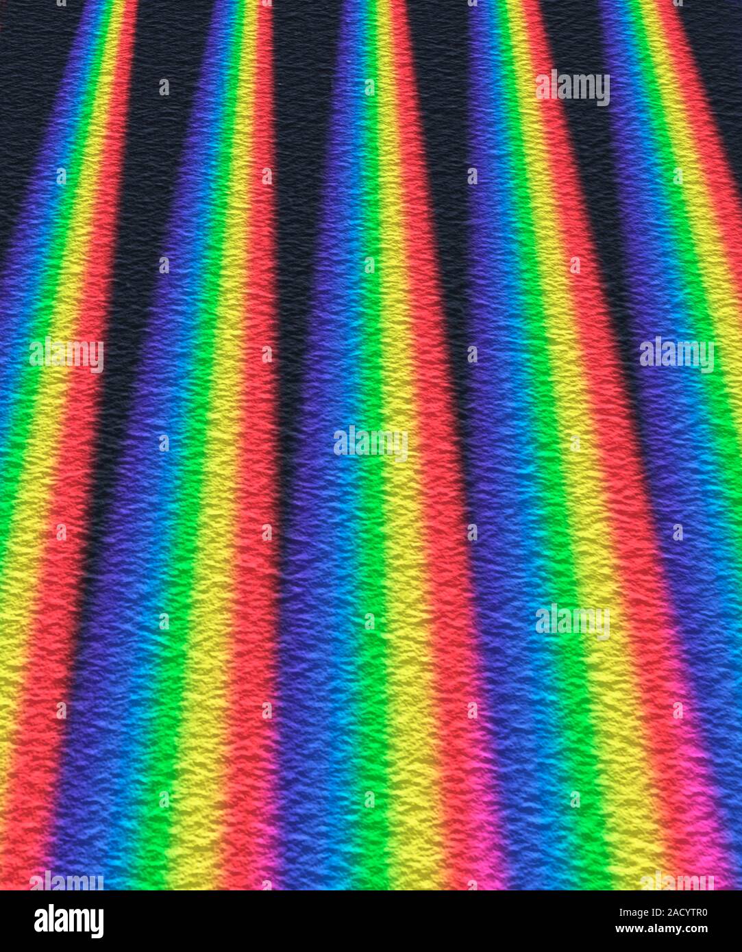 Multiple spectra of refracted beams of white light on a paper surface ...