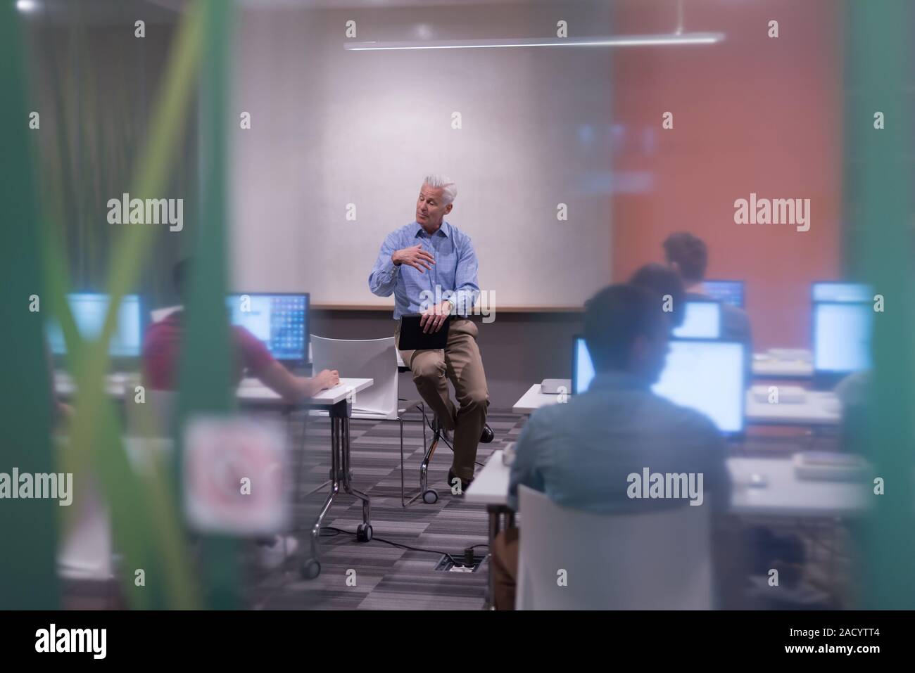 teacher and students in computer lab classroom Stock Photo - Alamy