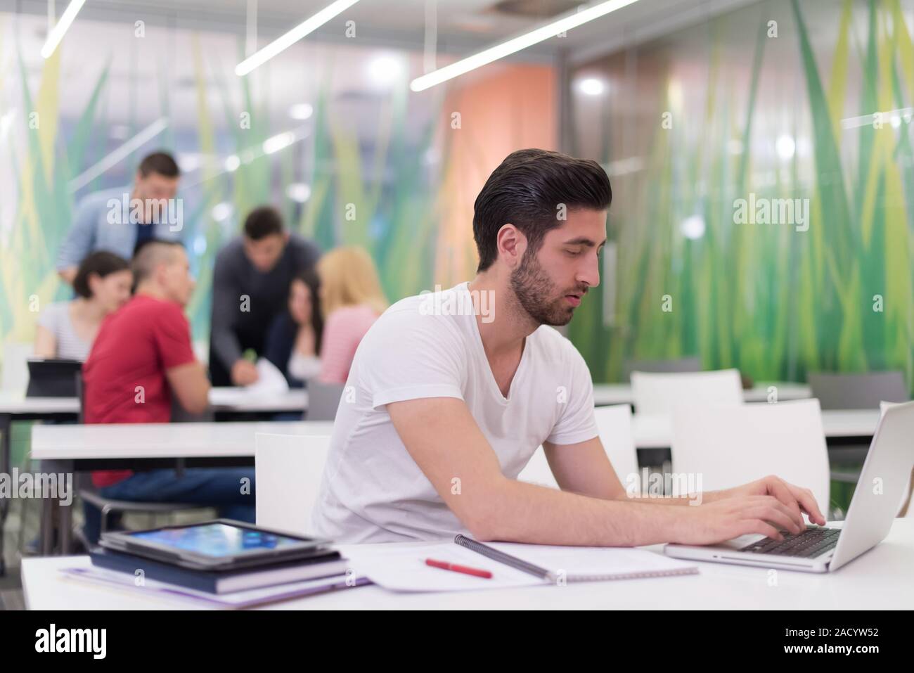 male student in classroom Stock Photo - Alamy