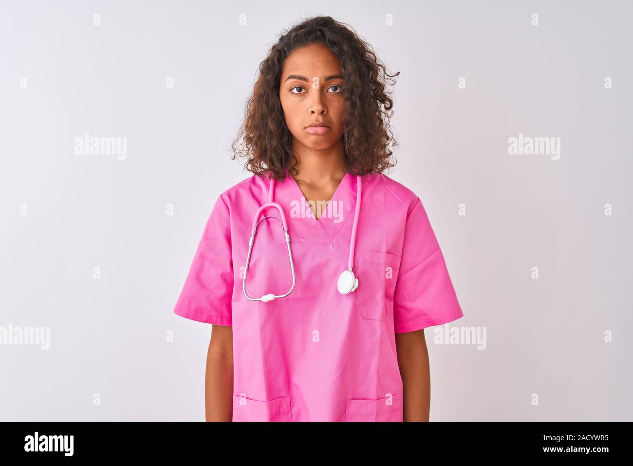 Young brazilian nurse woman wearing stethoscope standing over isolated ...