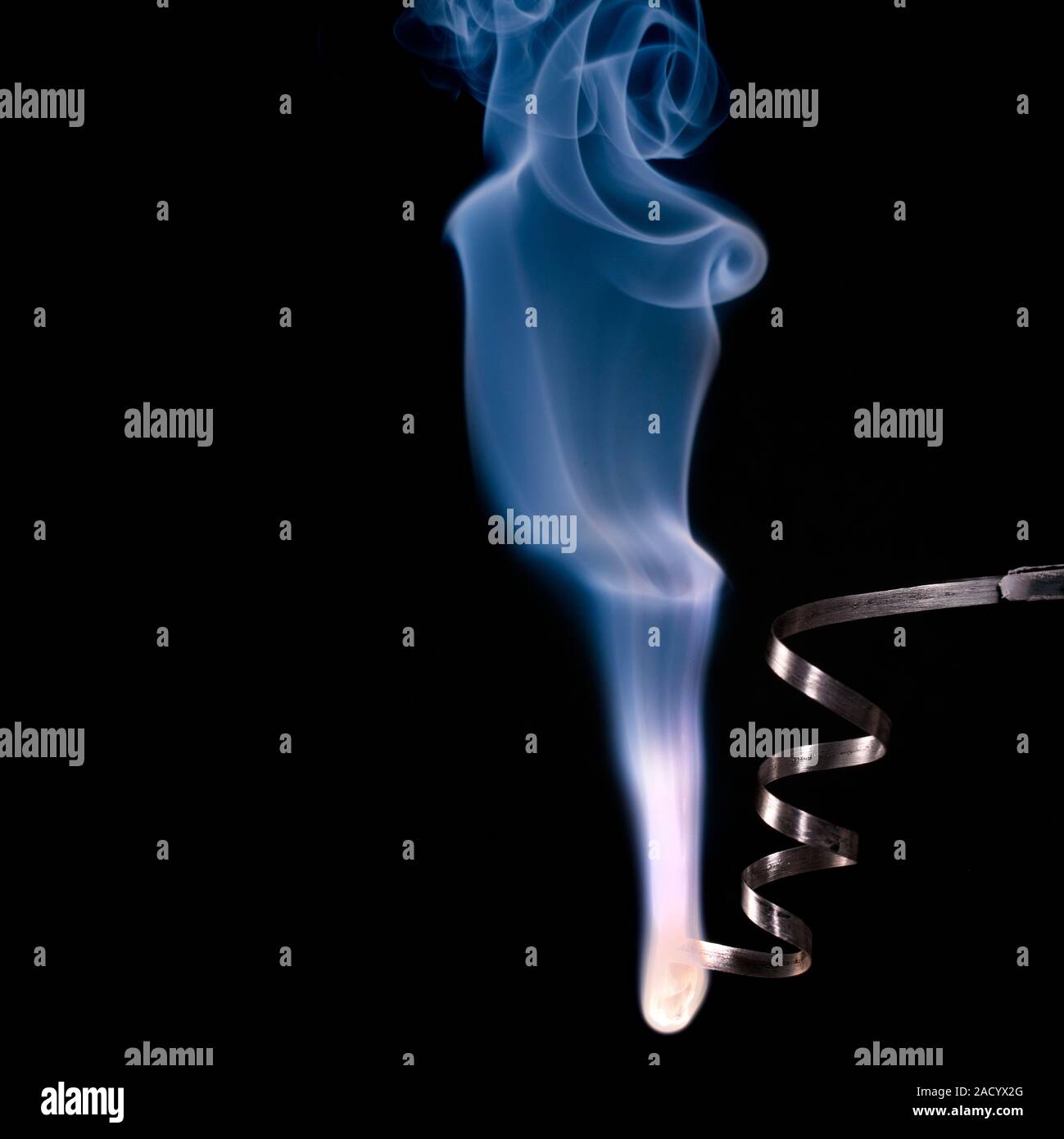 Magnesium ribbon burning in air. Magnesium is an alkaline earth metal ...