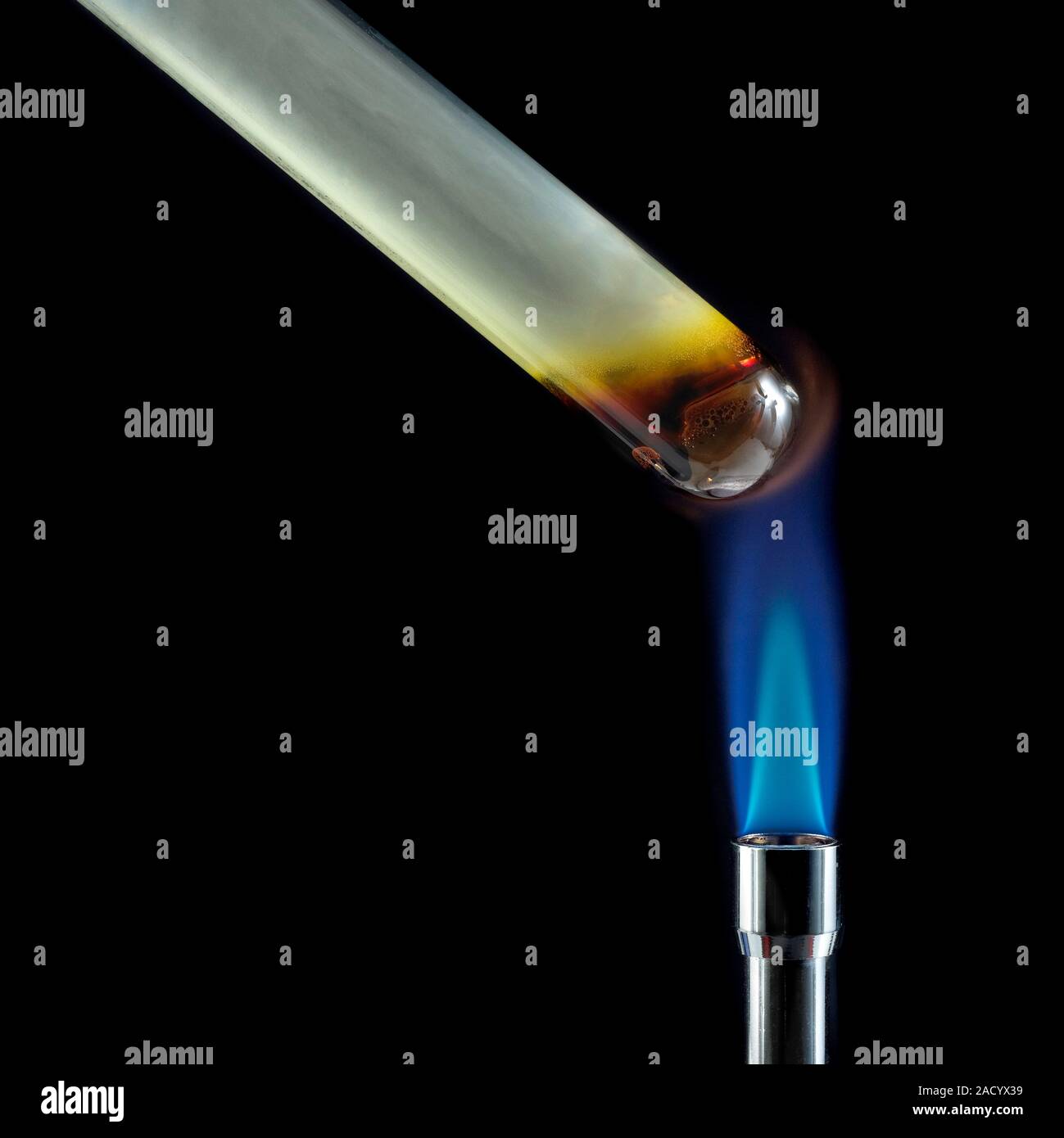 Sulphur being heated in a test tube. Sulphur is a yellow solid at room ...