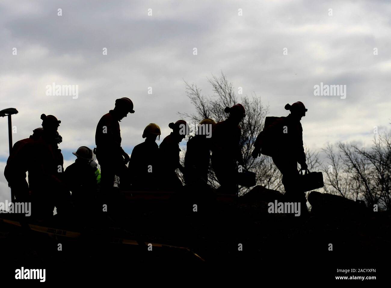 Training exercise for major emergency. Silhouetted firemen taking part ...
