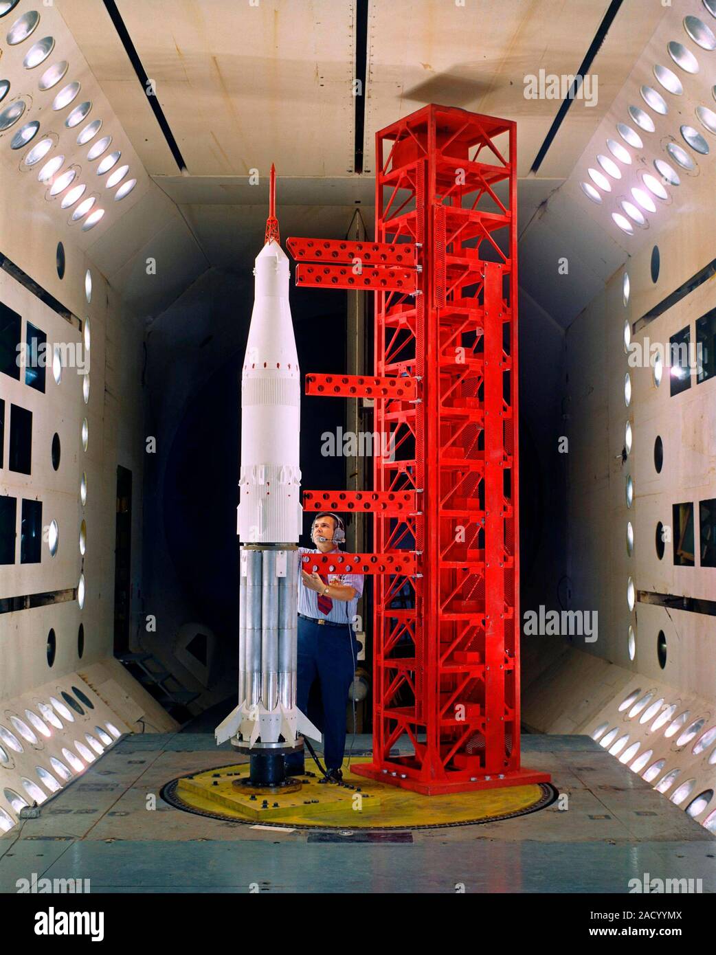 Saturn rocket model testing. Engineer preparing a model of the Saturn ...