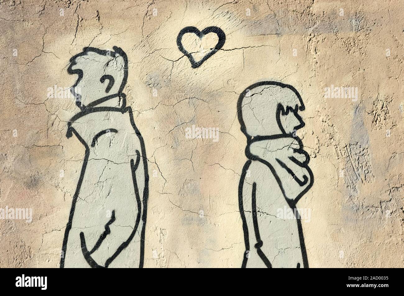 Man and woman fall in love with graffiti on the wall Stock Photo - Alamy