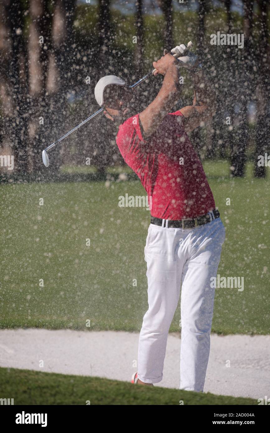 golfer hitting a sand bunker shot Stock Photo - Alamy