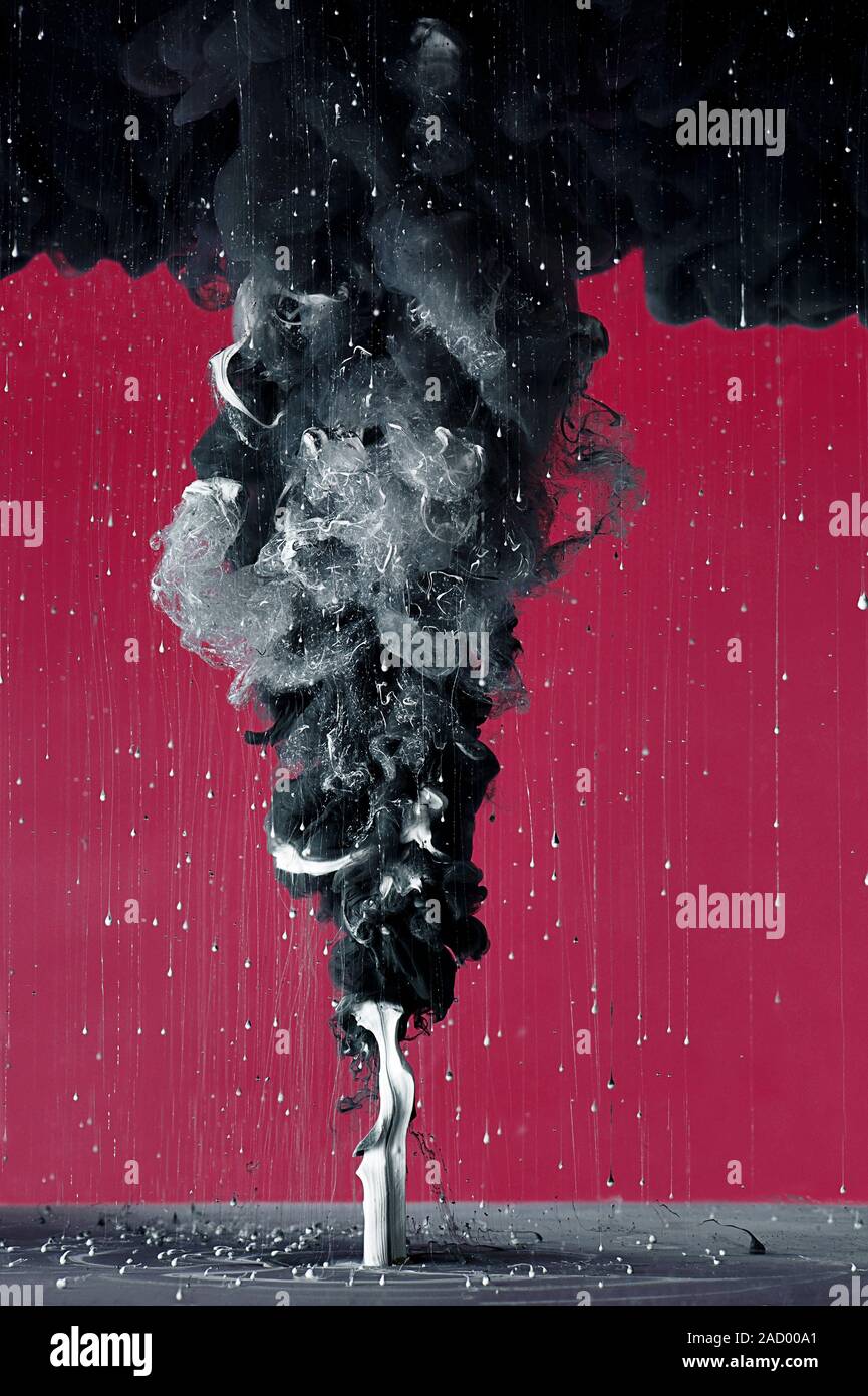 Paint falling in water. Swirling patterns of black and white paint ...