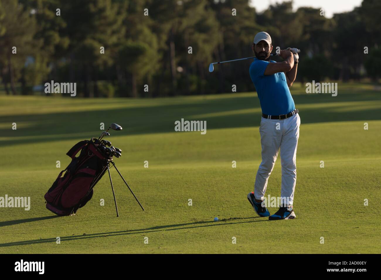 golfer hitting long shot Stock Photo - Alamy