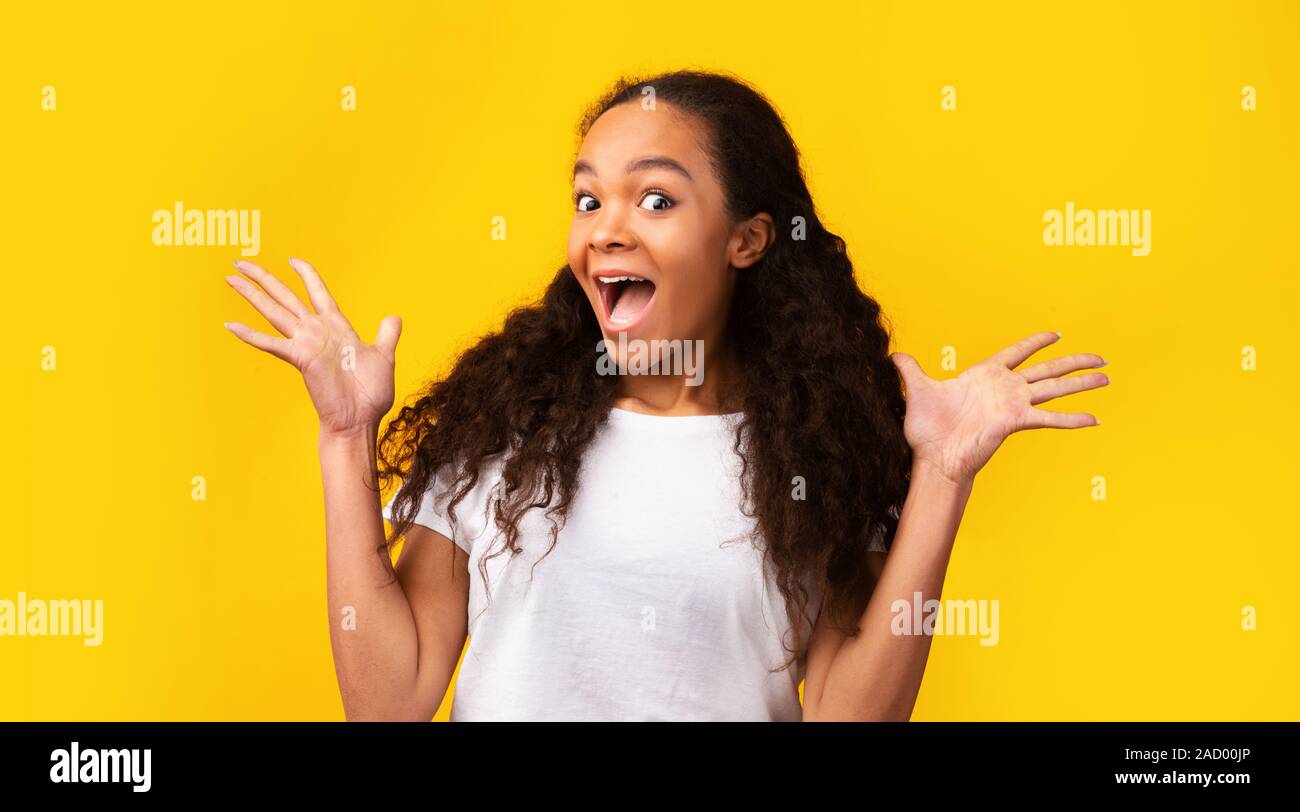 Shocked black teenager yelling and looking at camera Stock Photo - Alamy