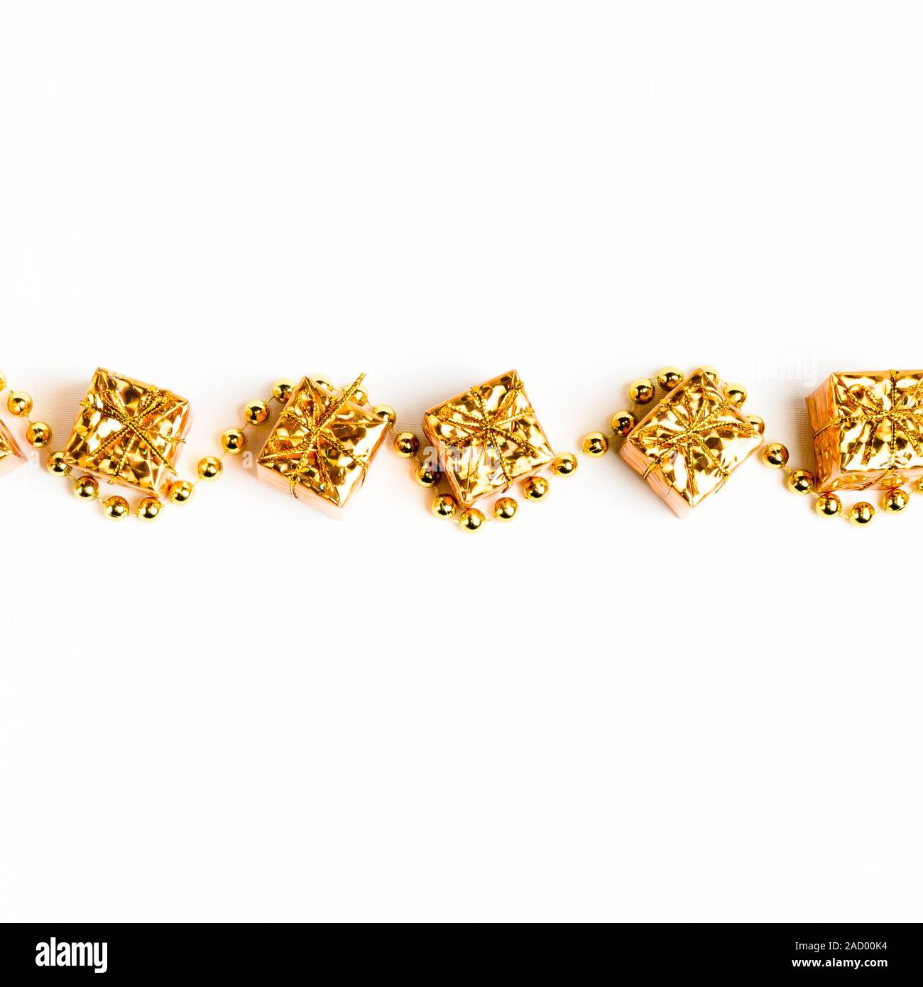 Christmas ornament of gold color, on a white background Stock Photo - Alamy