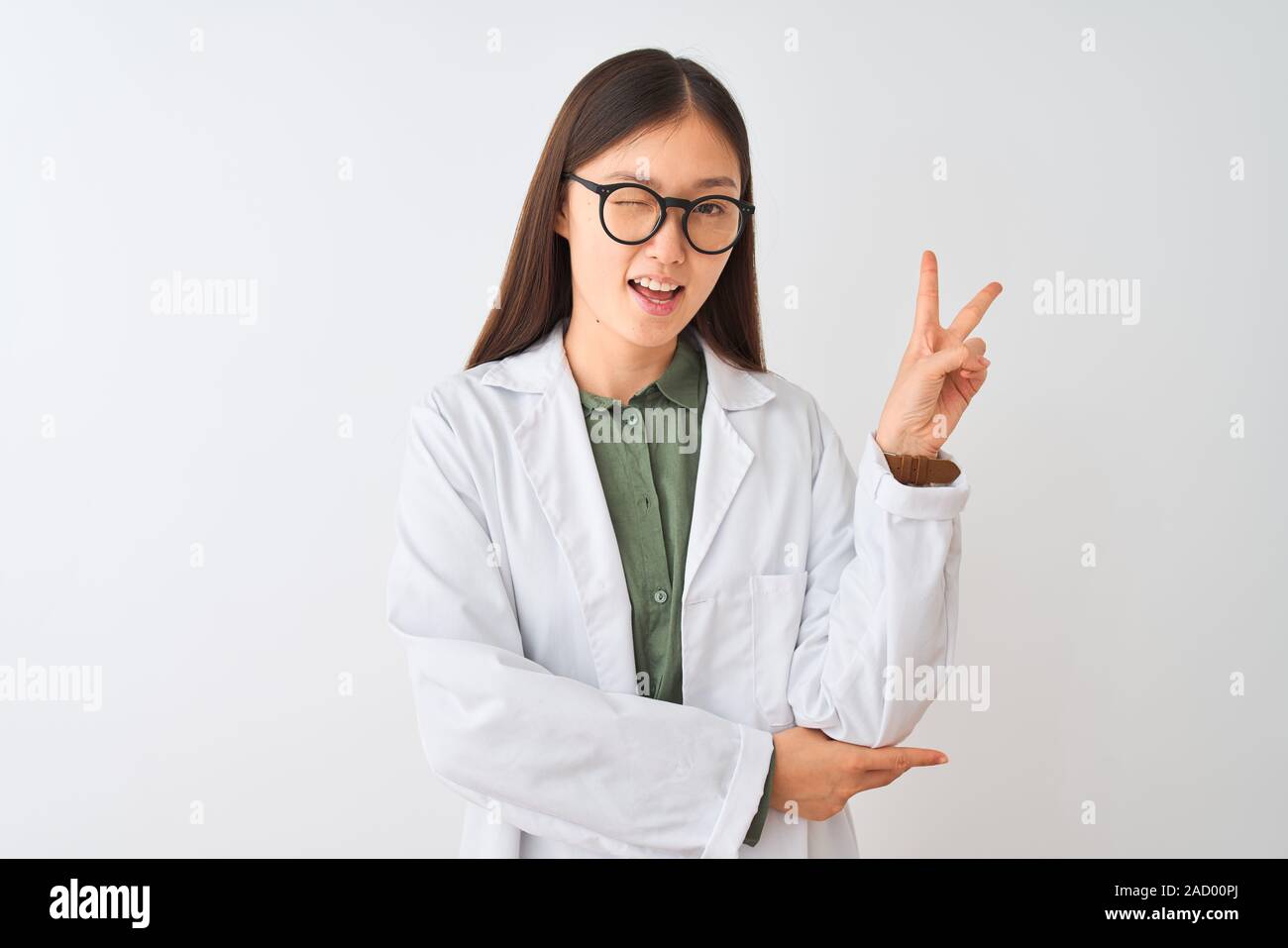 Young chinese scientist woman wearing coat and glasses over isolated ...